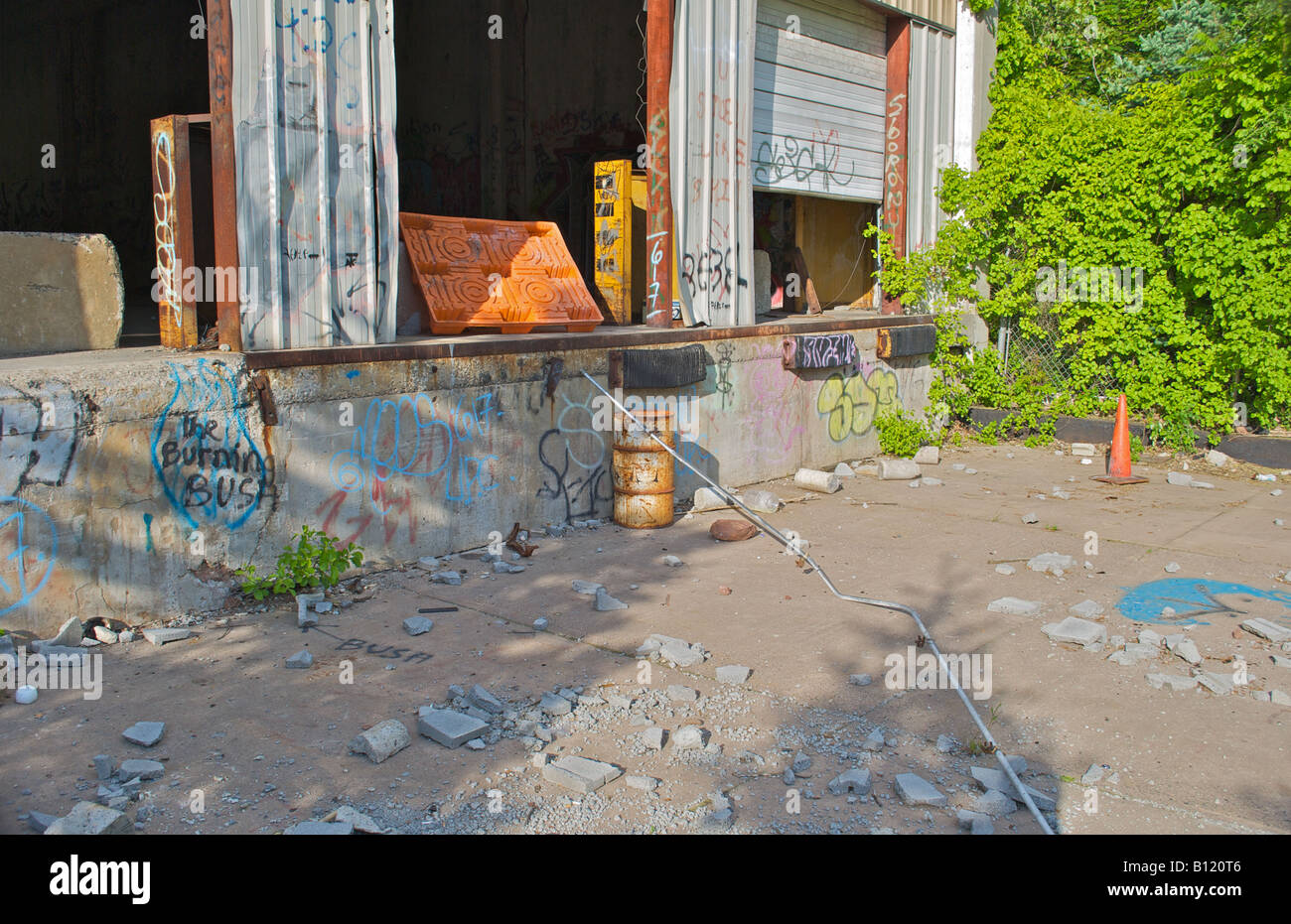 wide open dock on an abandoned factory building sprayed with graffiti ...