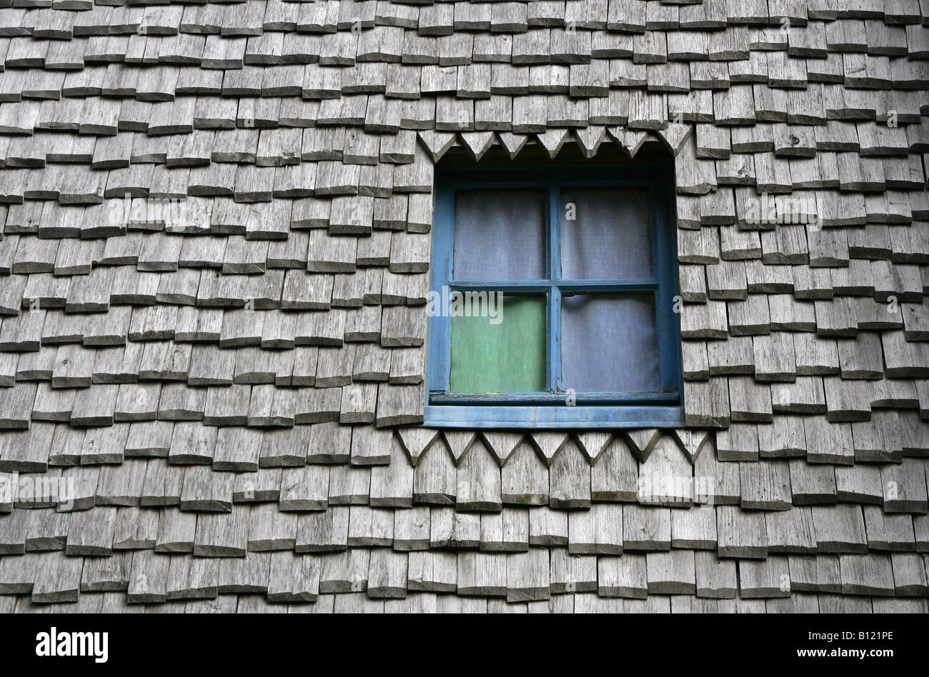 Colored window on a ancient wooden roof Stock Photo - Alamy