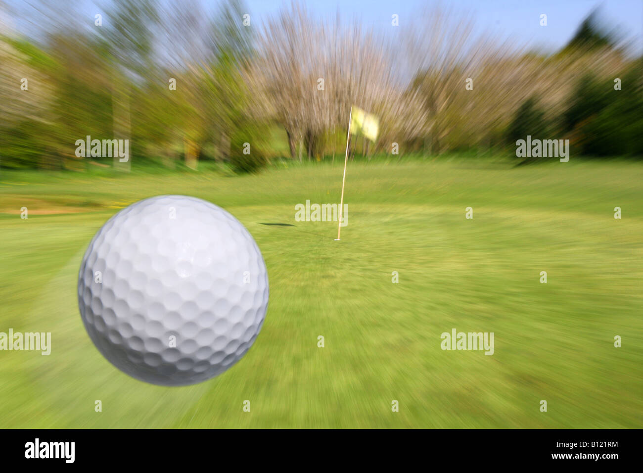 Golf ball flying Stock Photo - Alamy