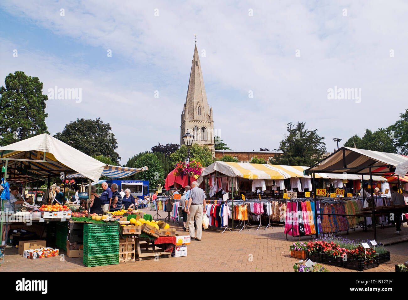 Market stalls and parish church Wellingborough Northamptonshire England ...