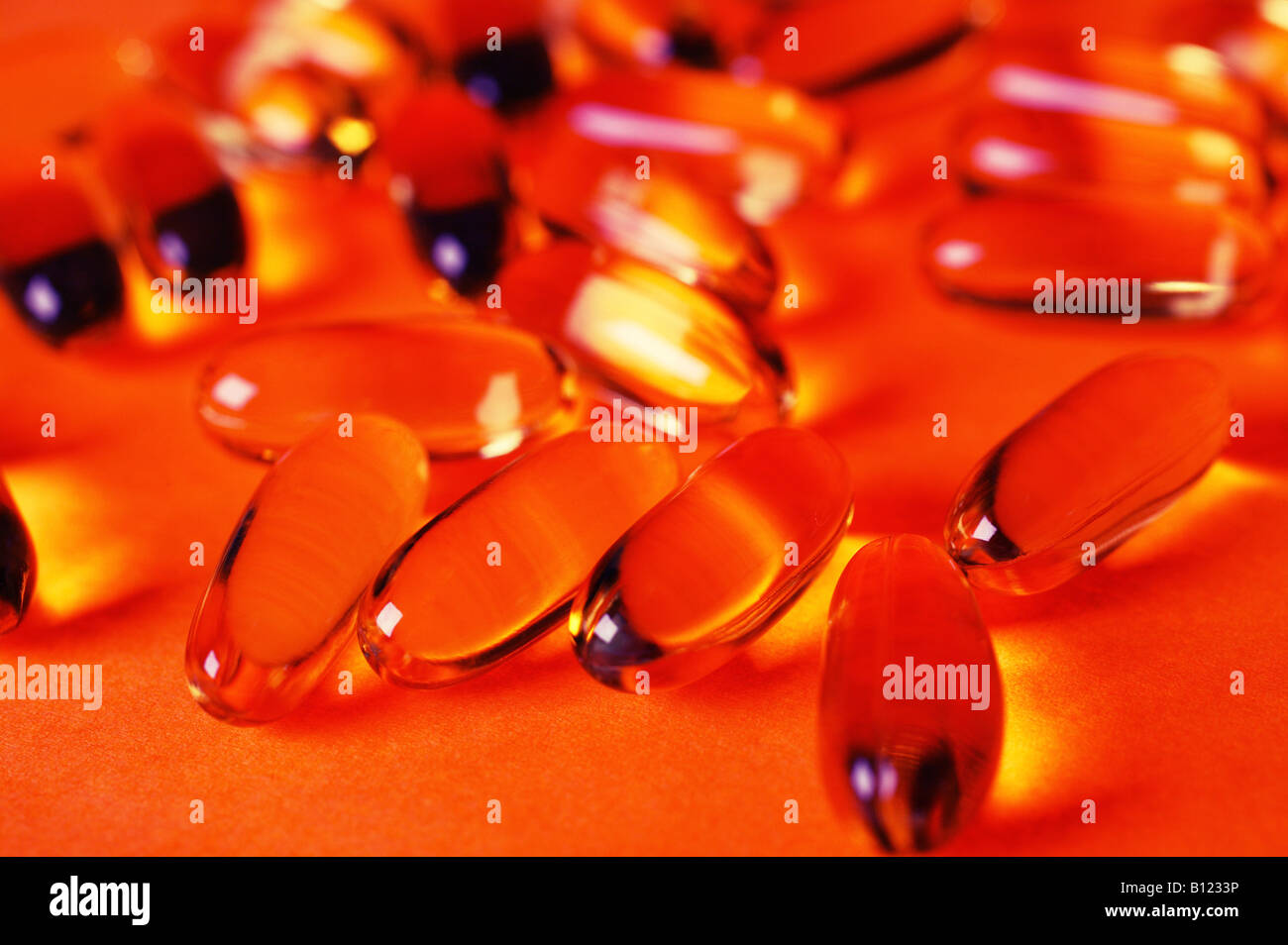 Close up of pharmaceutical drugs on orange background Stock Photo - Alamy