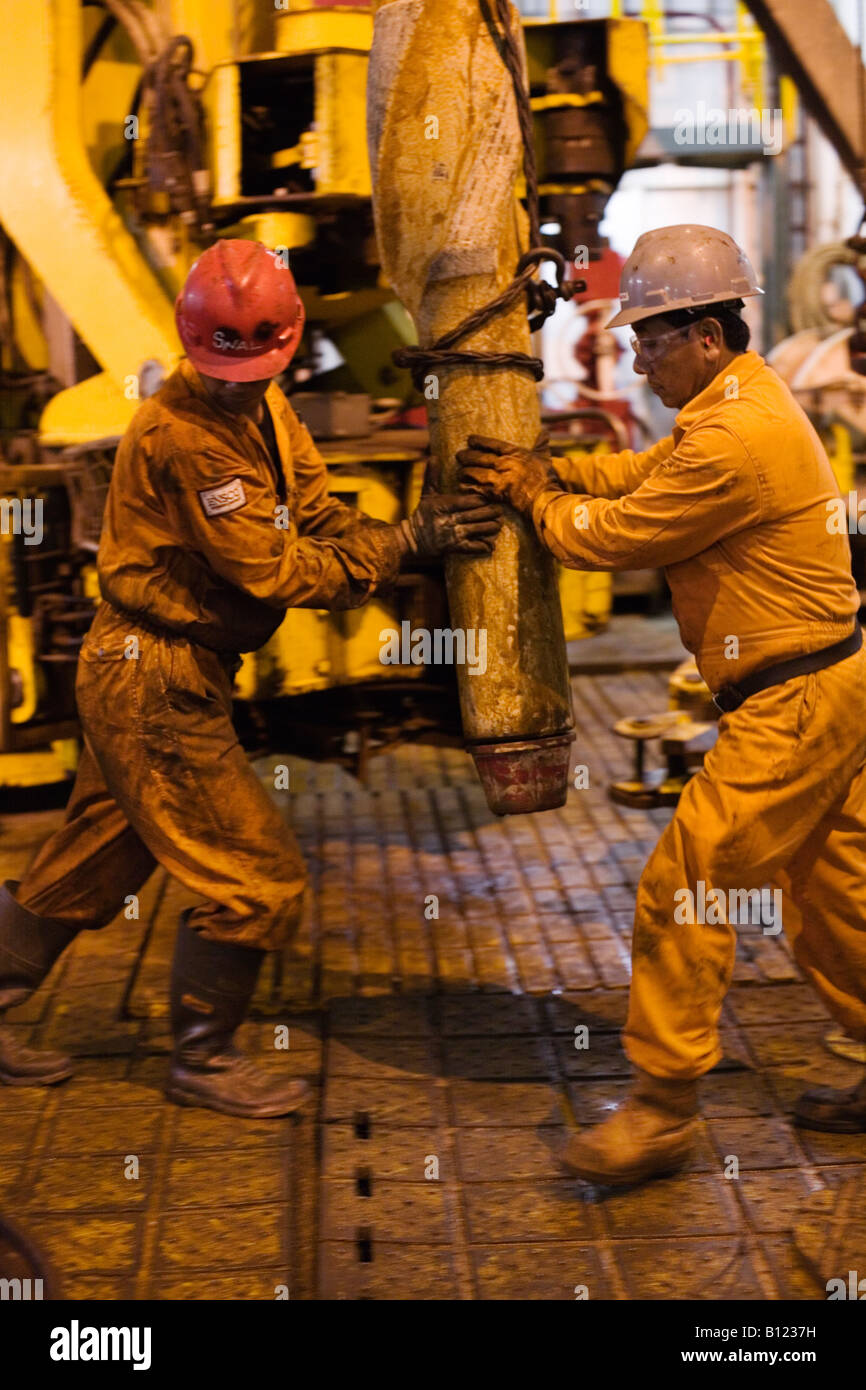 Oil workers on drill floor. Ensco rig. Natuna Field. Sea South China ...