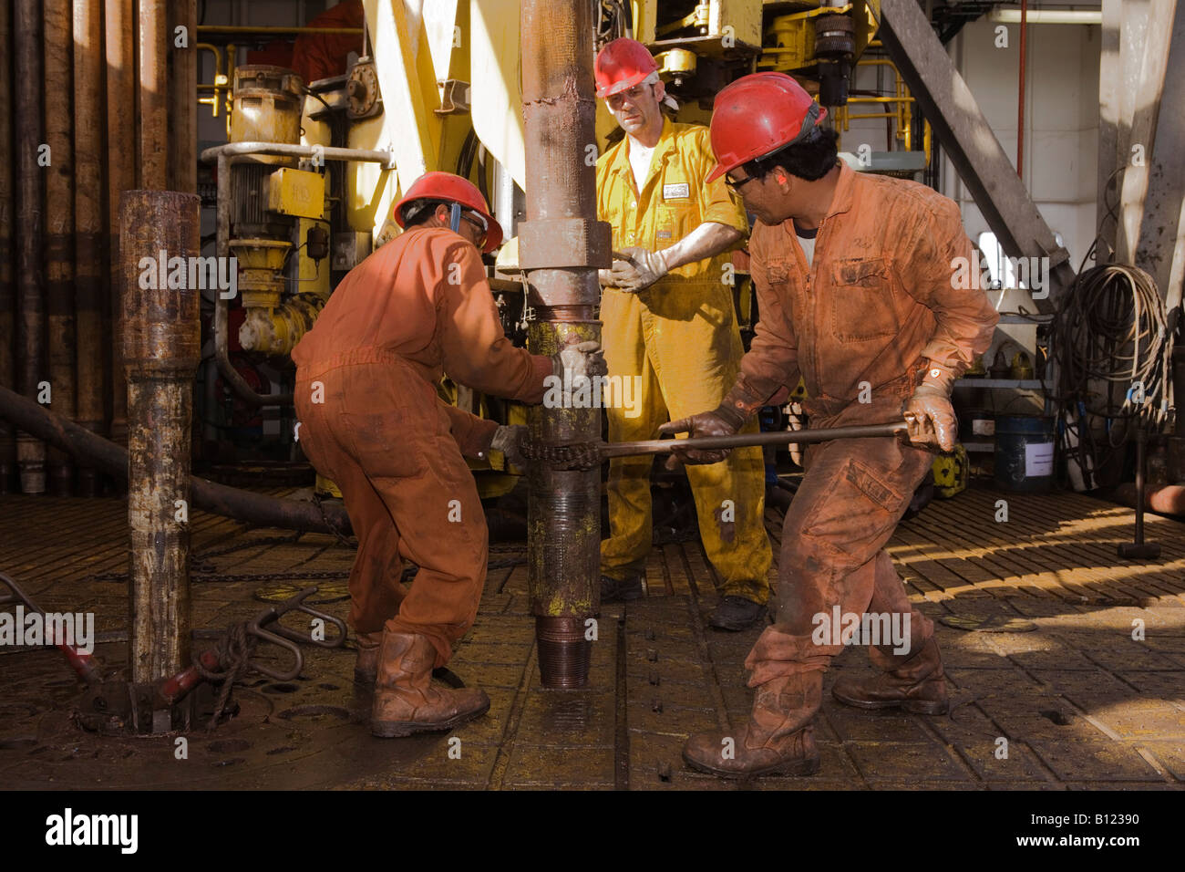 Oil workers on drill floor. Ensco rig. Natuna Field. Sea South China ...
