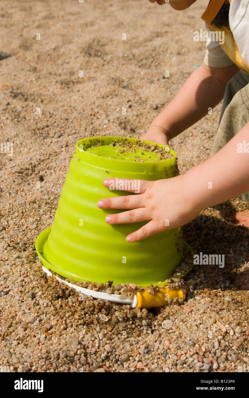 small boy making a sandcastle Stock Photo - Alamy