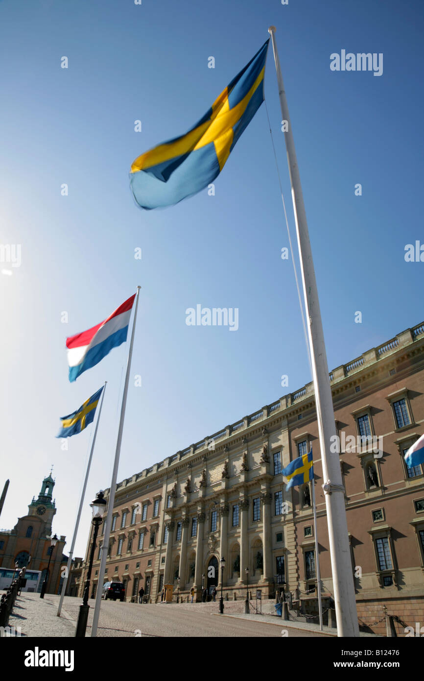 Swedish flag flying outside the Kungliga Slottet or Royal Palace, Gamla ...