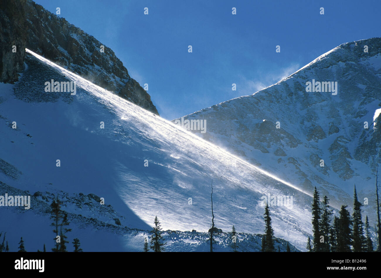 Wind blows snow from a ridgeline in the Never Summer mountains in ...