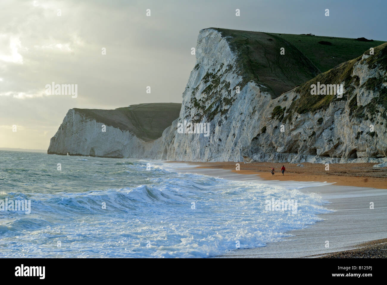 Beach and white chalk cliffs on the Jurassic coast Dorset England ...