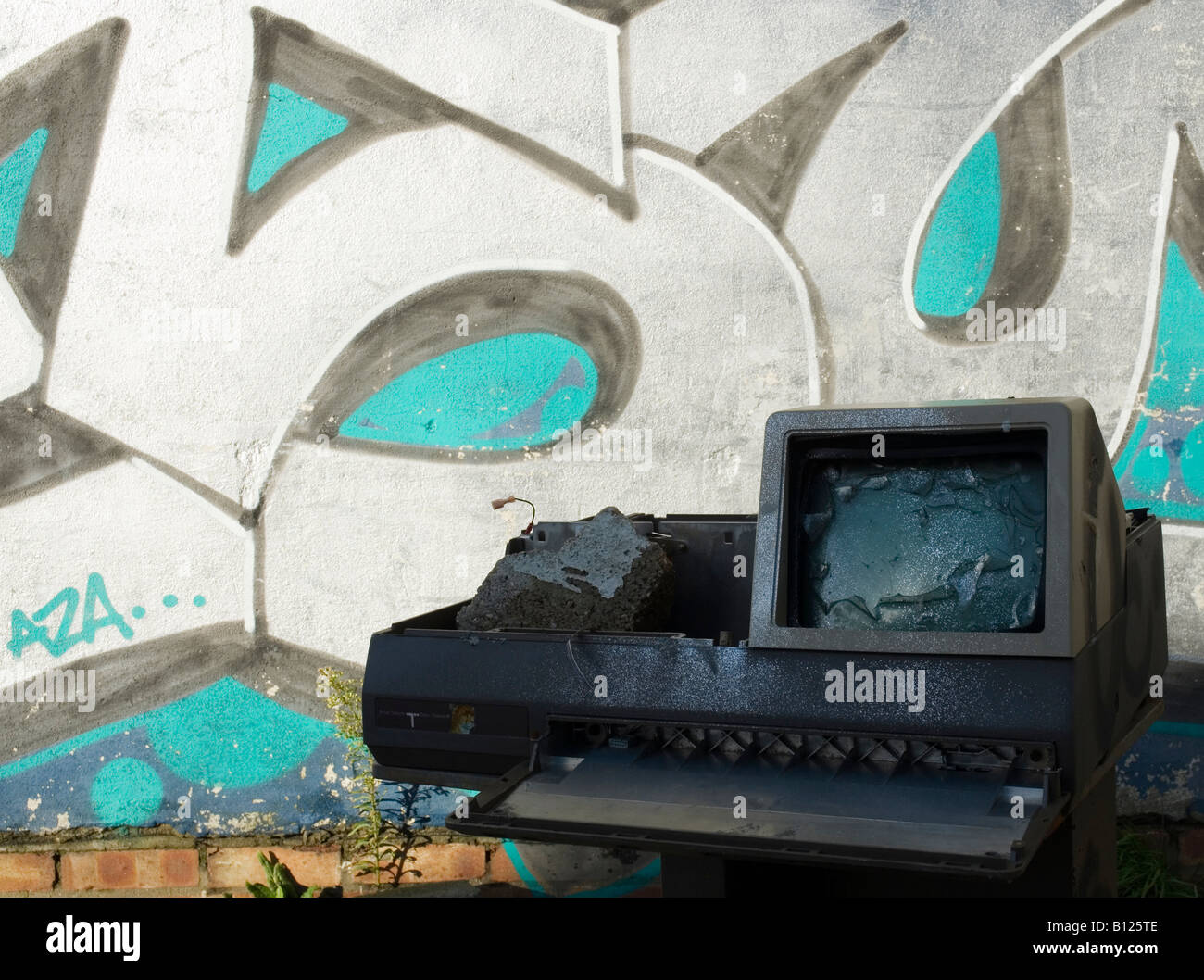Burnt computer terminal and graffiti Stock Photo - Alamy