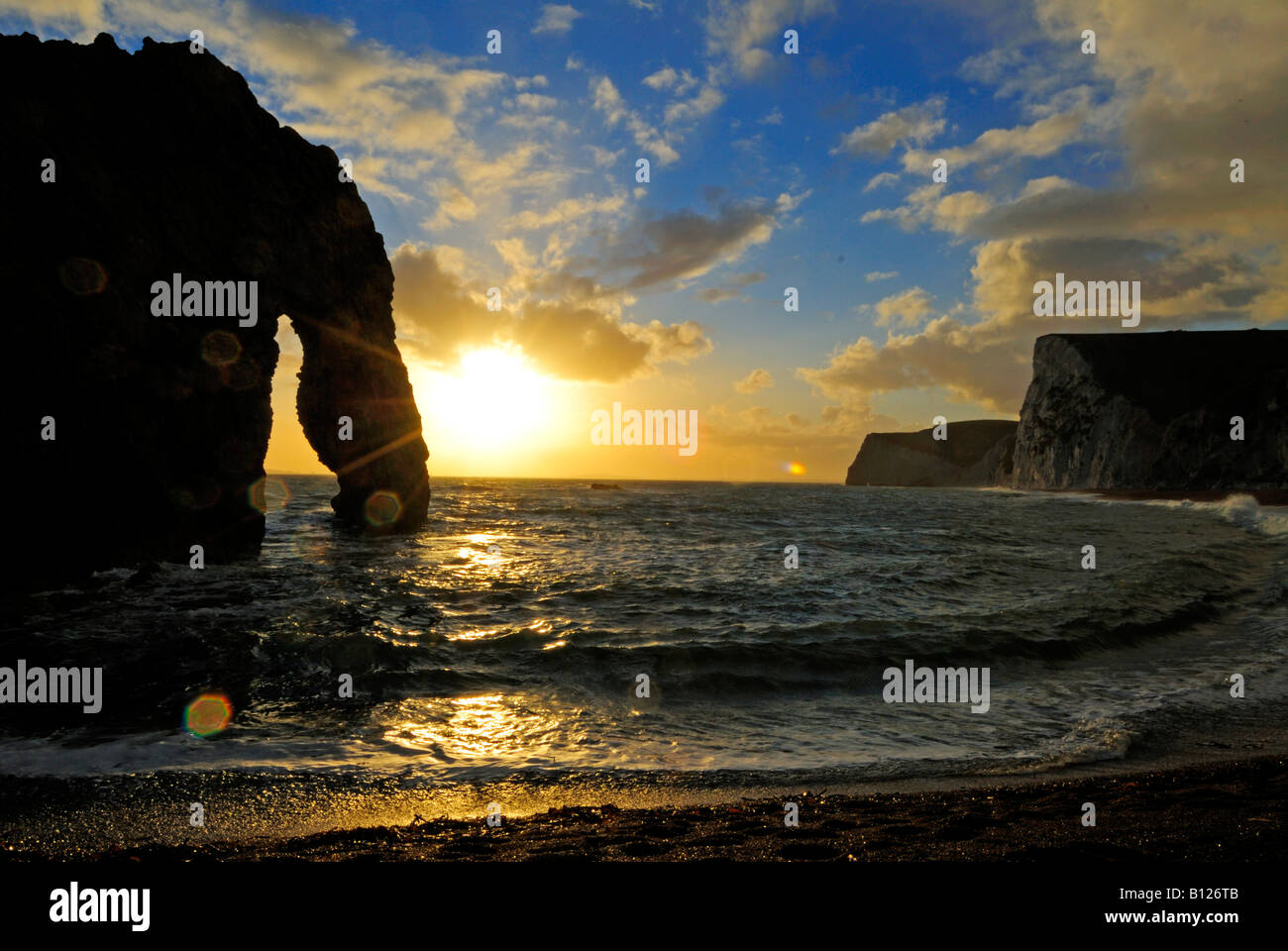 Durdle Door natural limestone arch at sunset Stock Photo - Alamy