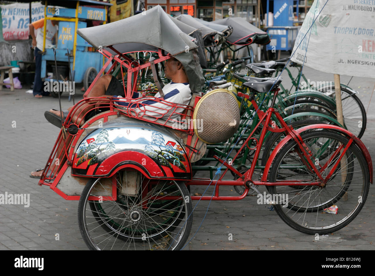 Becak driver on the street of Yogyakarta (Jogja), Java, Indonesia Stock ...