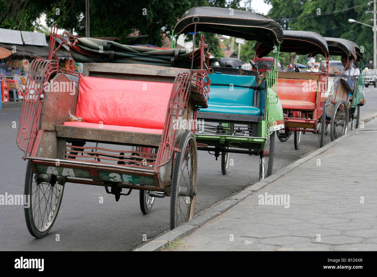 Becaks (rickshaw) on the street of Yogyakarta, Java, Indonesia, Asia ...
