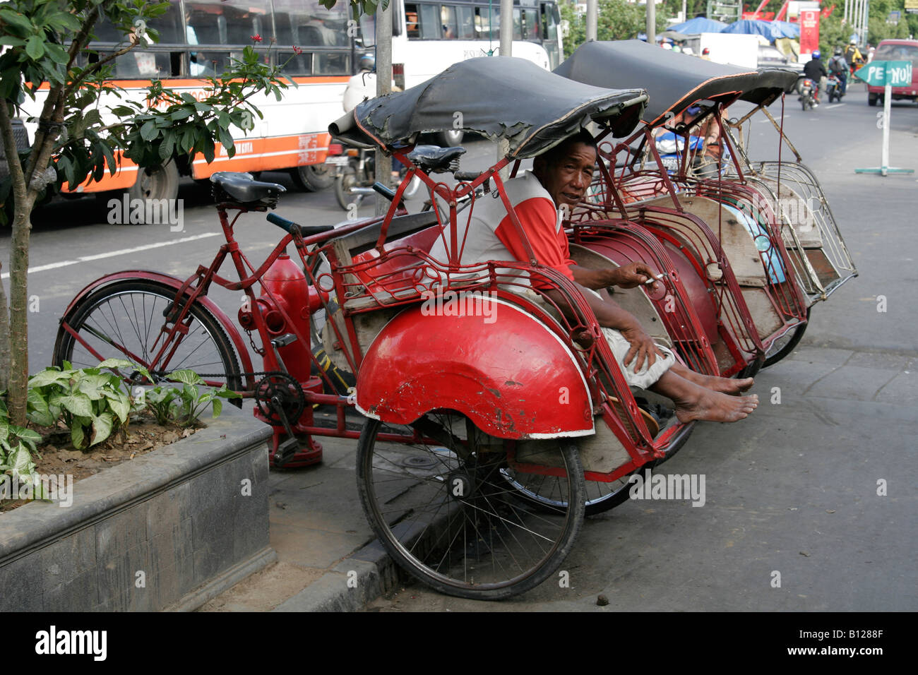 Becak driver on the street of Yogyakarta, Java, Indonesia Stock Photo ...