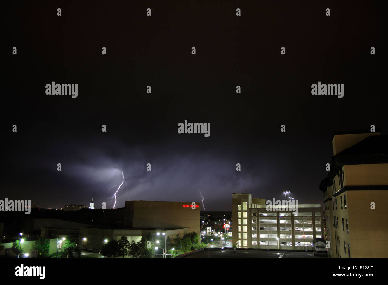 Lightning over a city Stock Photo - Alamy
