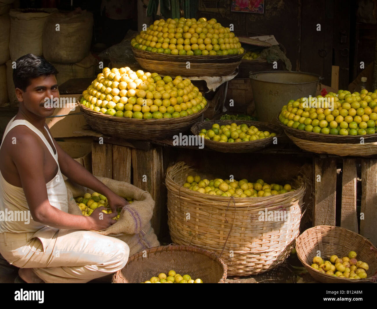lemon vendor in Calcutta market Stock Photo - Alamy
