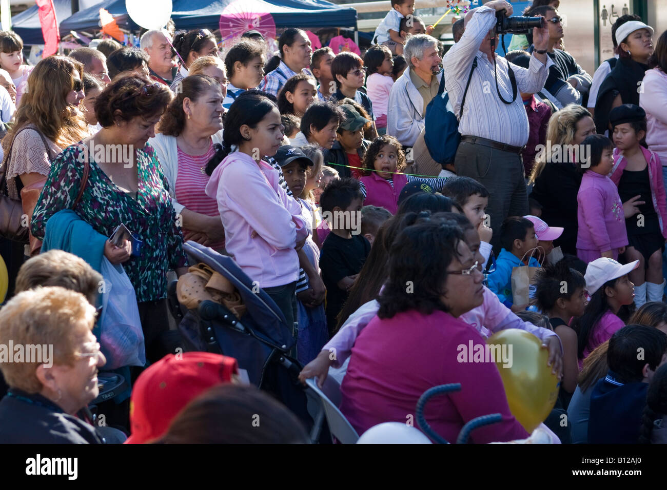 A crowd of people watching a performance Stock Photo - Alamy