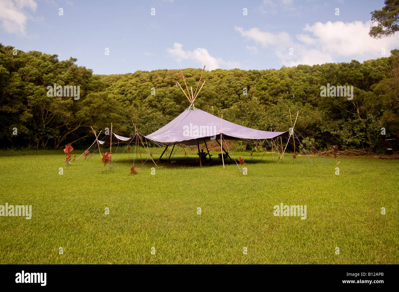 Lone figure sits inside a large modern style Tipi on the Hawaiian ...