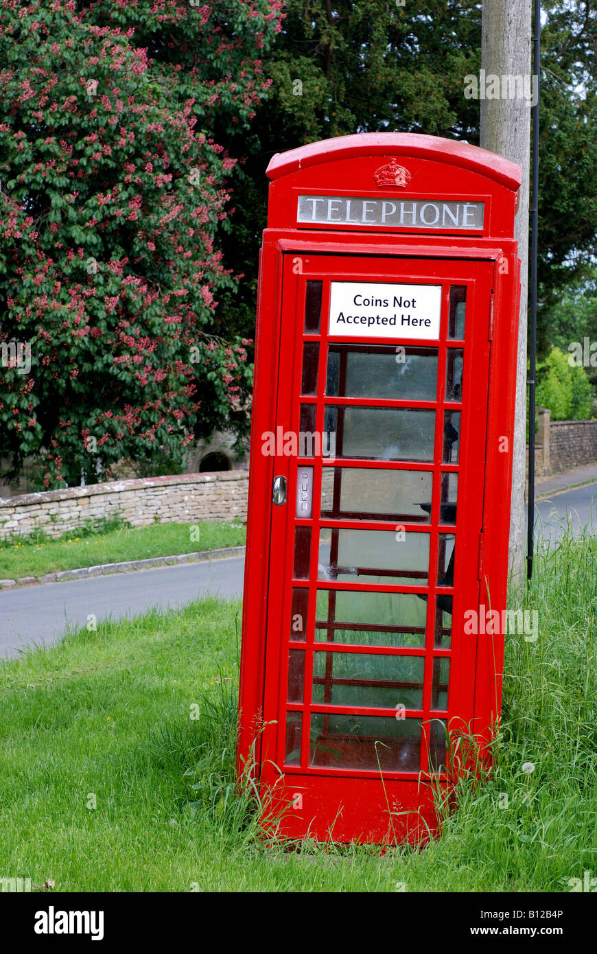 Red telephone box with COINS NOT ACCEPTED HERE notice, UK Stock Photo ...