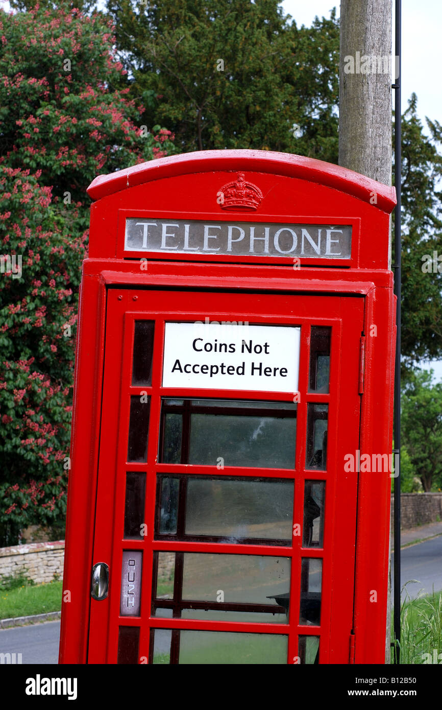 Red telephone box with COINS NOT ACCEPTED HERE notice, UK Stock Photo ...