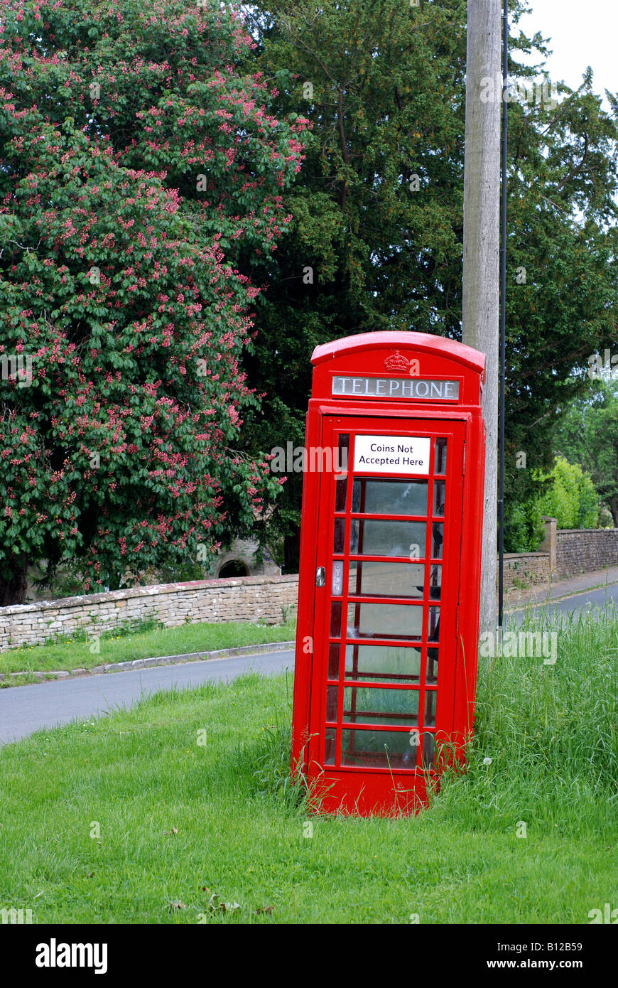 Red telephone box with COINS NOT ACCEPTED HERE notice, UK Stock Photo ...