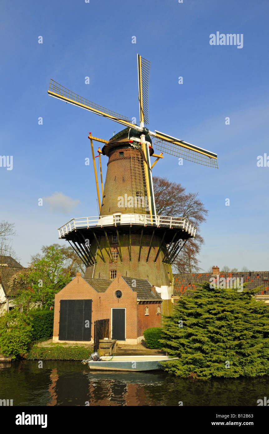 Traditional Dutch windmill along canal Holland Europe Stock Photo - Alamy