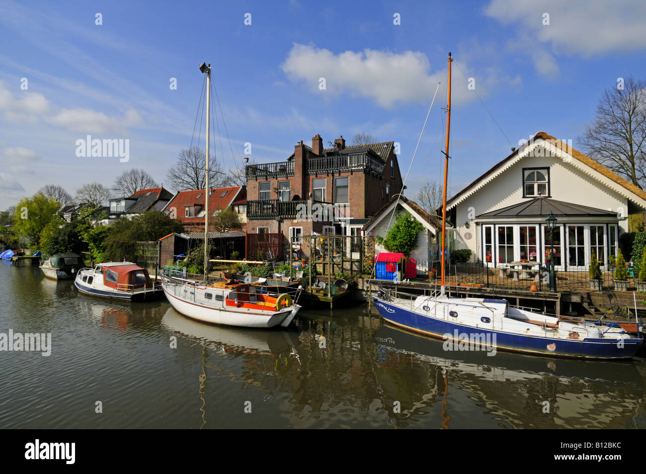 Boats and houses along Dutch canals Holland Europe Stock Photo - Alamy