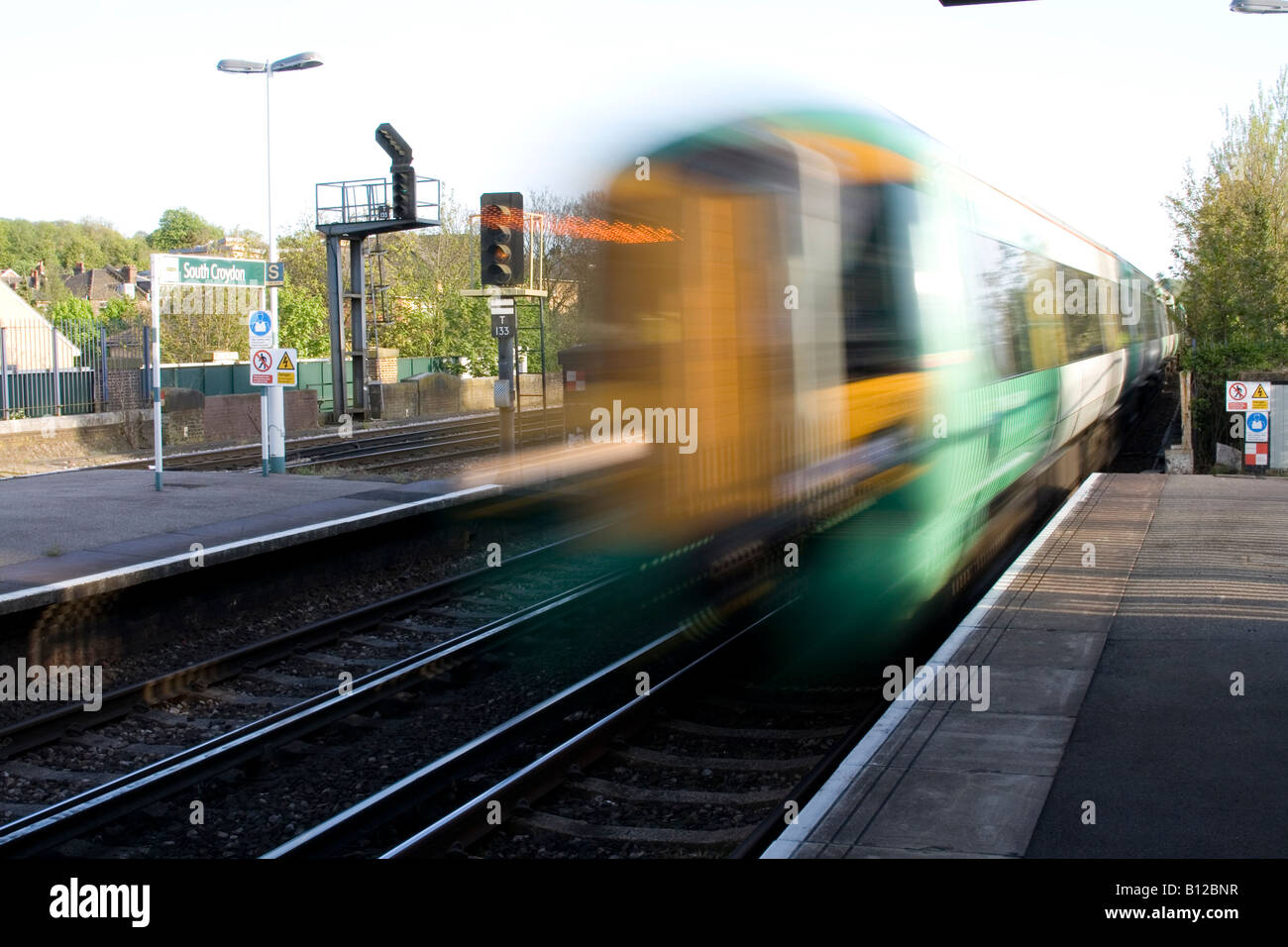 A train rushes passed Stock Photo - Alamy