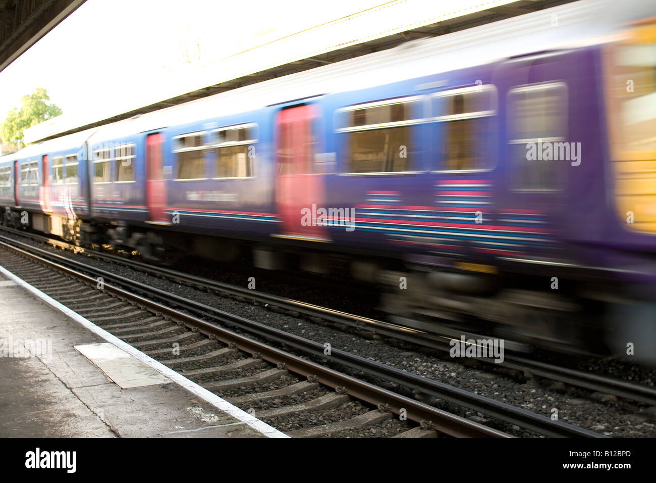A train rushes passed Stock Photo - Alamy
