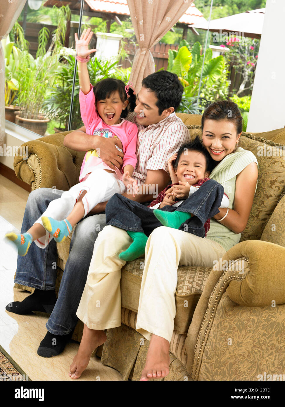 Children watching television with parents Stock Photo - Alamy