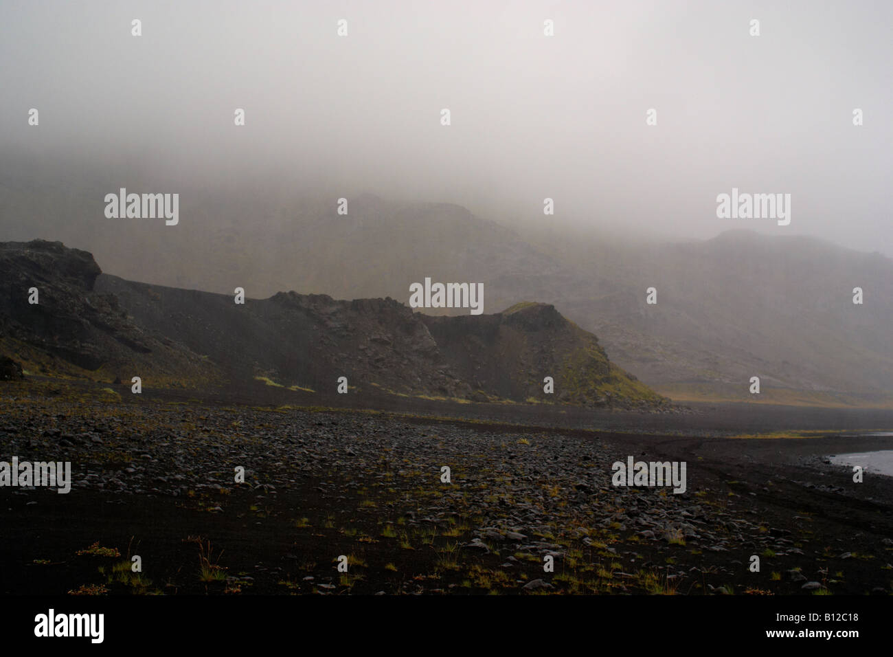 Lava coastal cliff on the black lava beach at Reykjanes peninsula ...