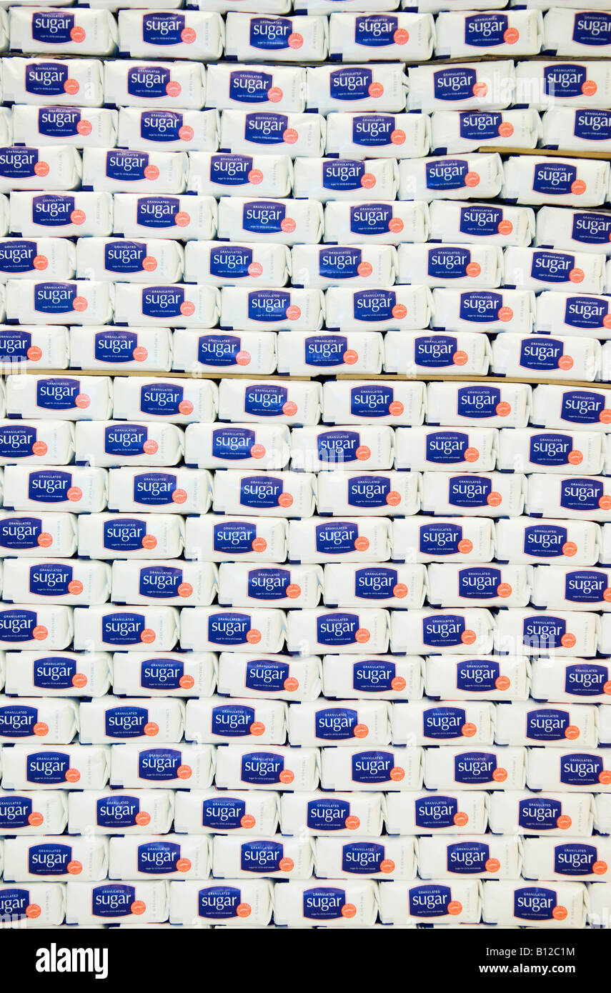 Stack of bags of white sugar on supermarket shelf Stock Photo - Alamy