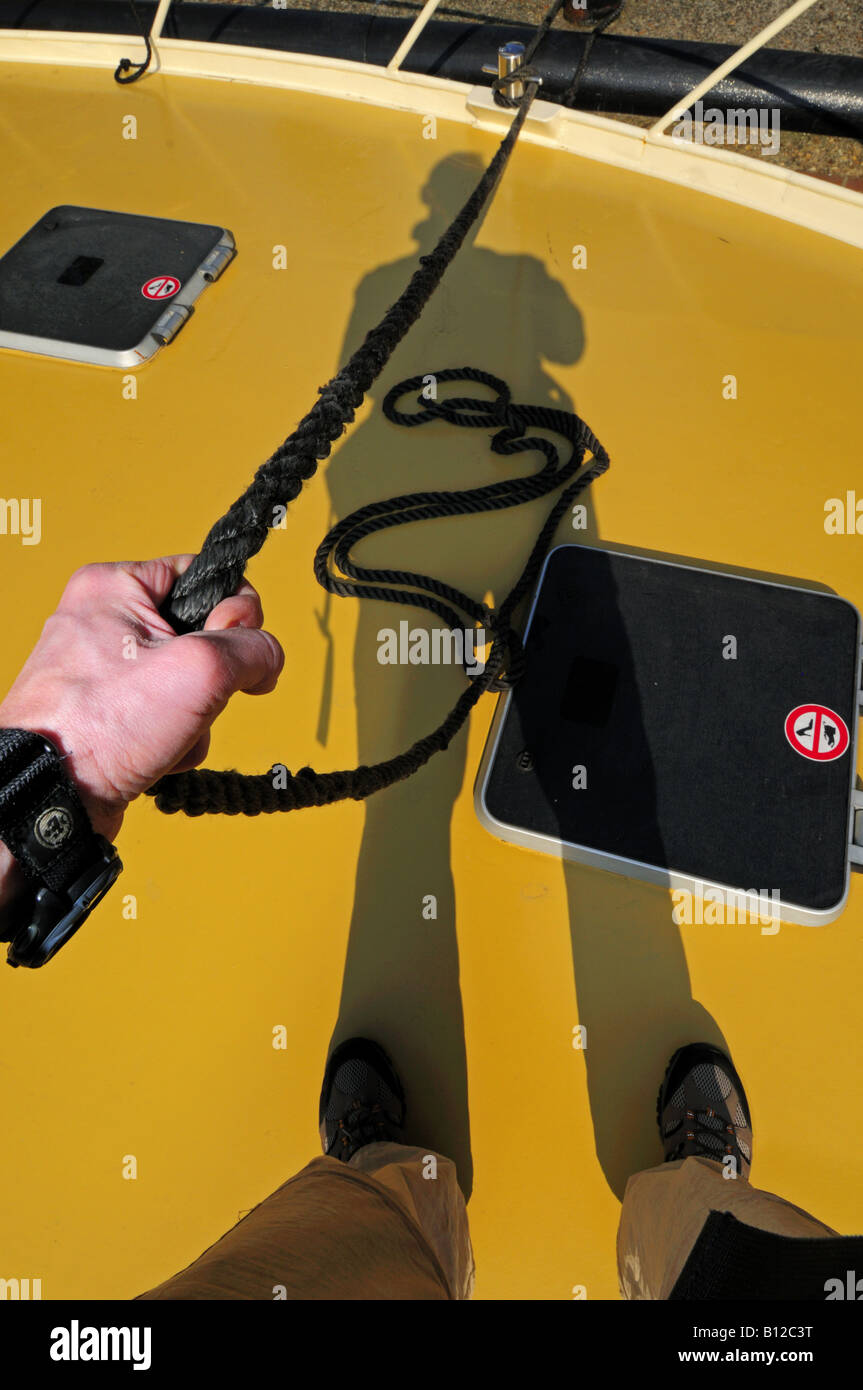 Tying ropes on yacht Holland Europe Stock Photo - Alamy
