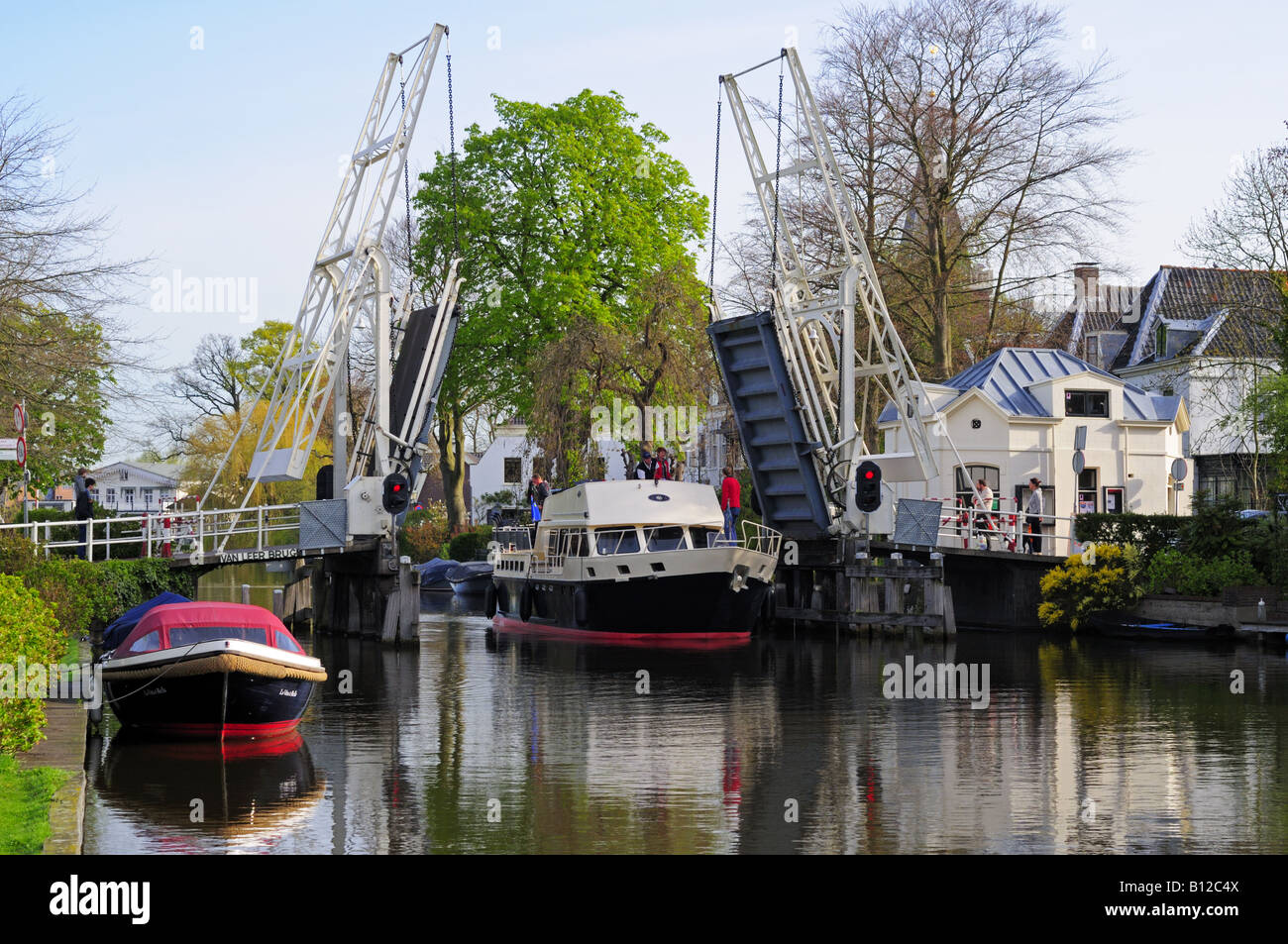 Yacht passing through open bridge on Dutch canal Holland Europe Stock ...