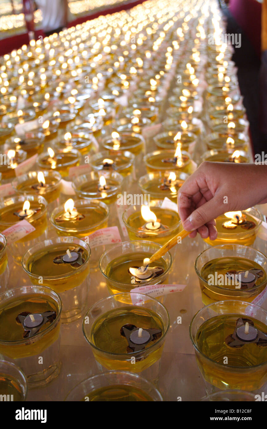 Lighting Up Oil Lamps On Wesak Day Celebration Stock Photo - Alamy