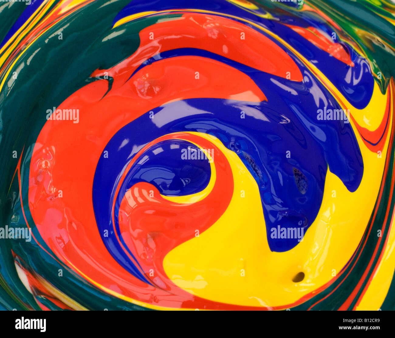 abstract of bright coloured paints mixed with each other Stock Photo ...