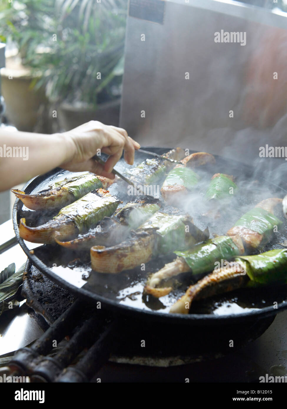 grilled sting ray on the hot plate Stock Photo - Alamy