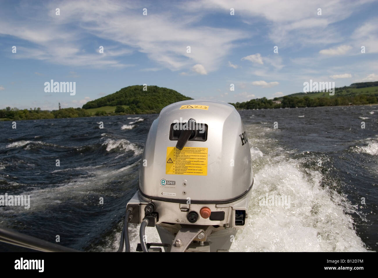 outboard engine in action on Ullswater in the English Lake district ...