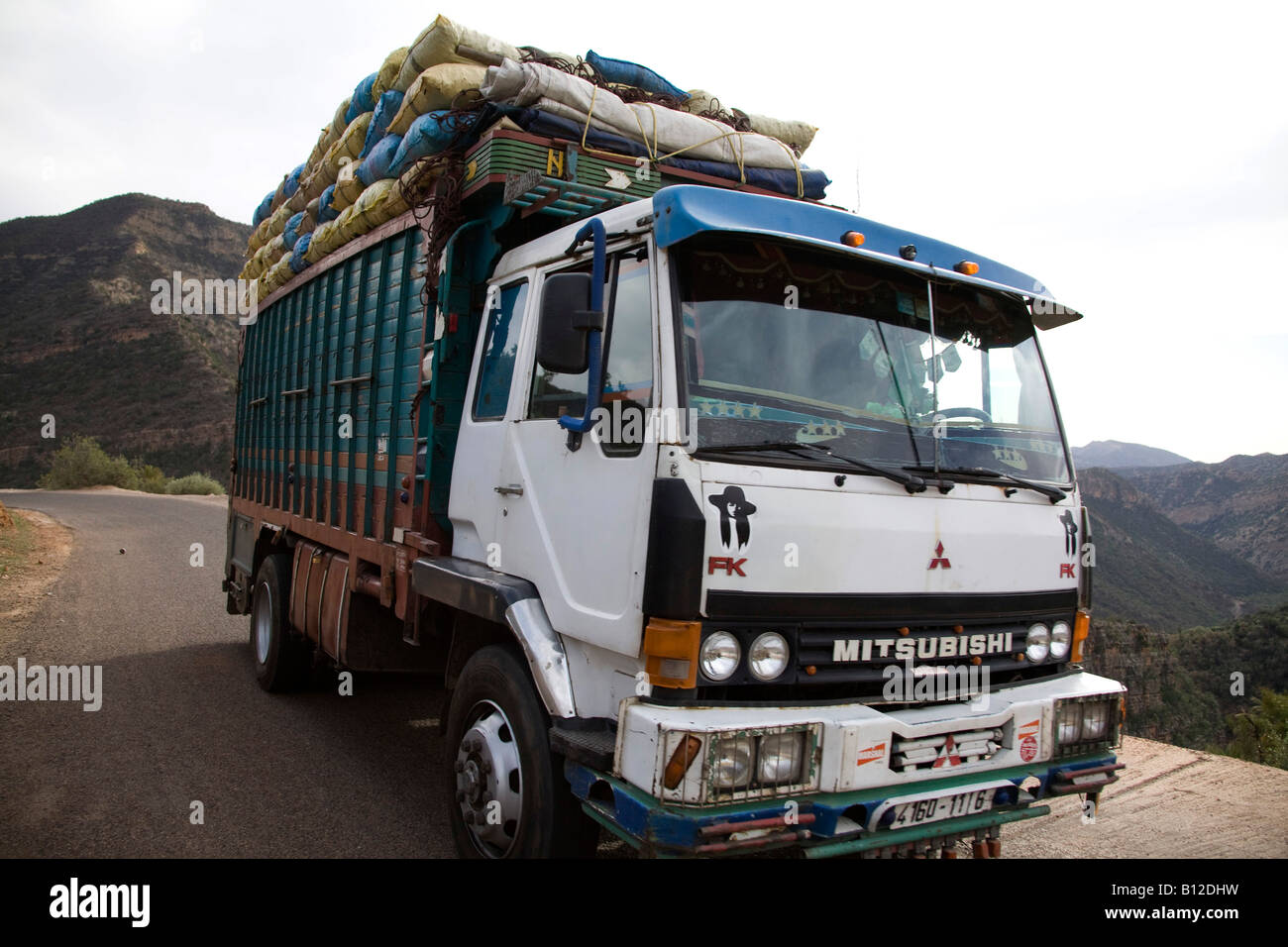 Lorry transporting sacs of food in mountain road near Agadir, Morocco ...