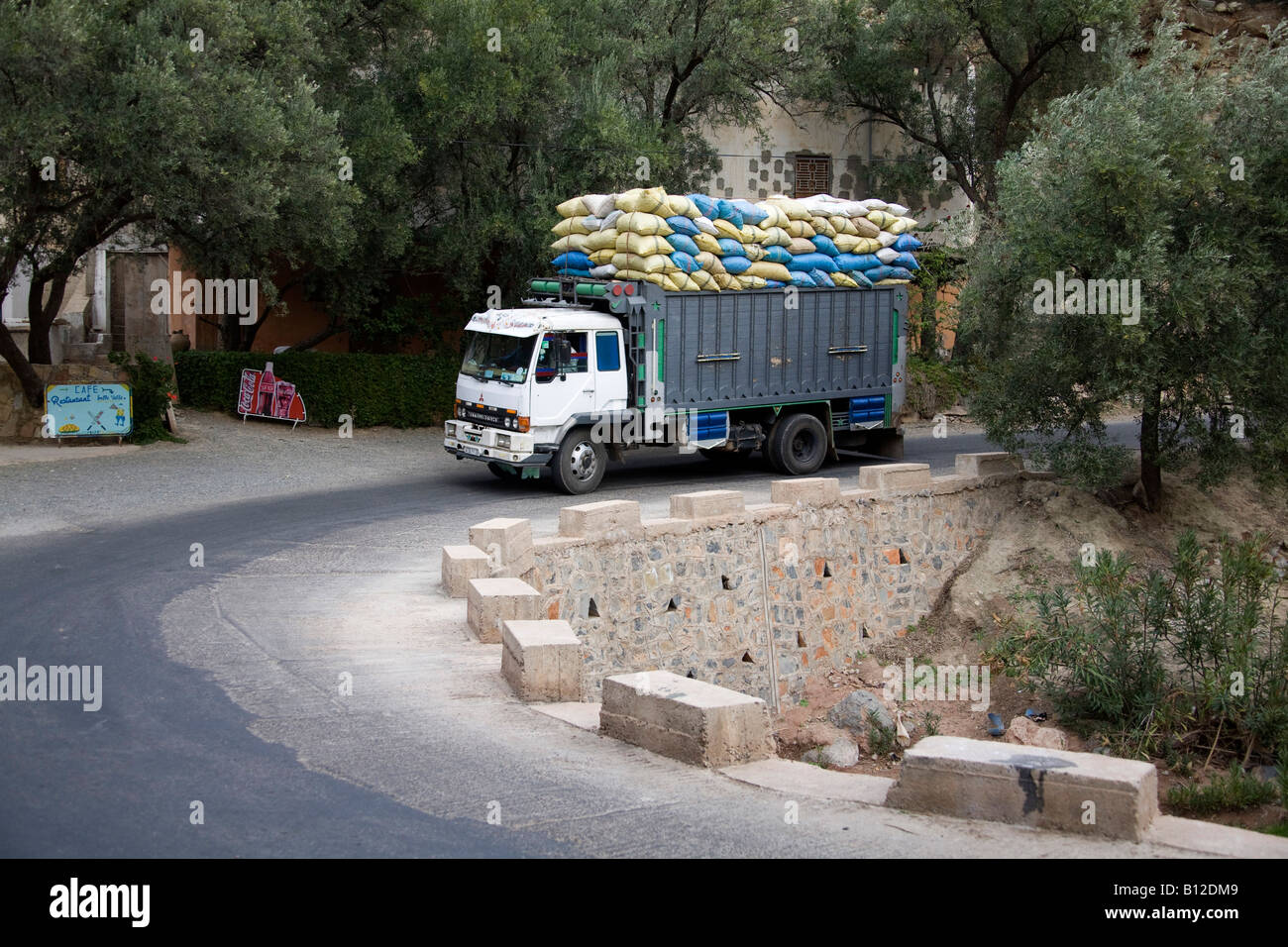 Lorry transporting sacs of food in mountain road near Agadir, Morocco ...