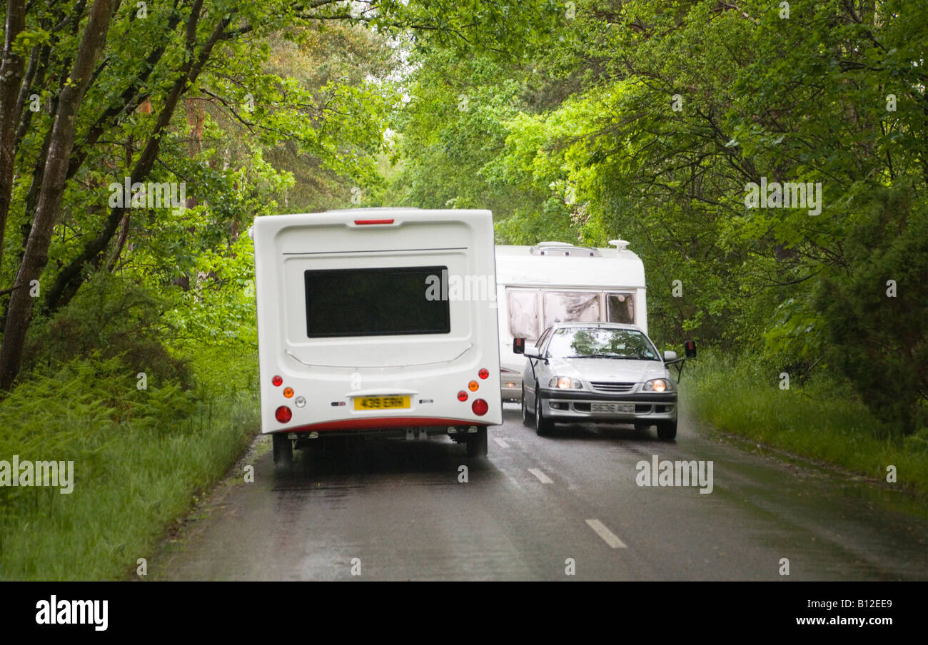 Two caravans passing each other in the New Forest National Park ...