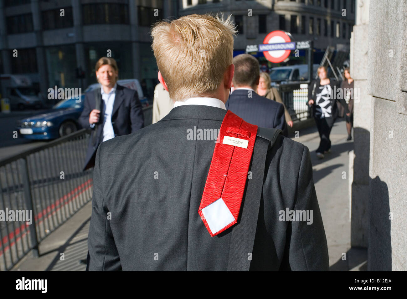a man with a red tie in the city of london Stock Photo - Alamy