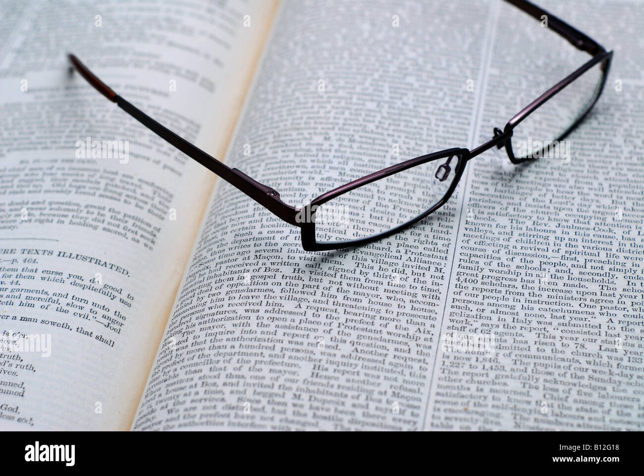 reading glasses on book Stock Photo - Alamy