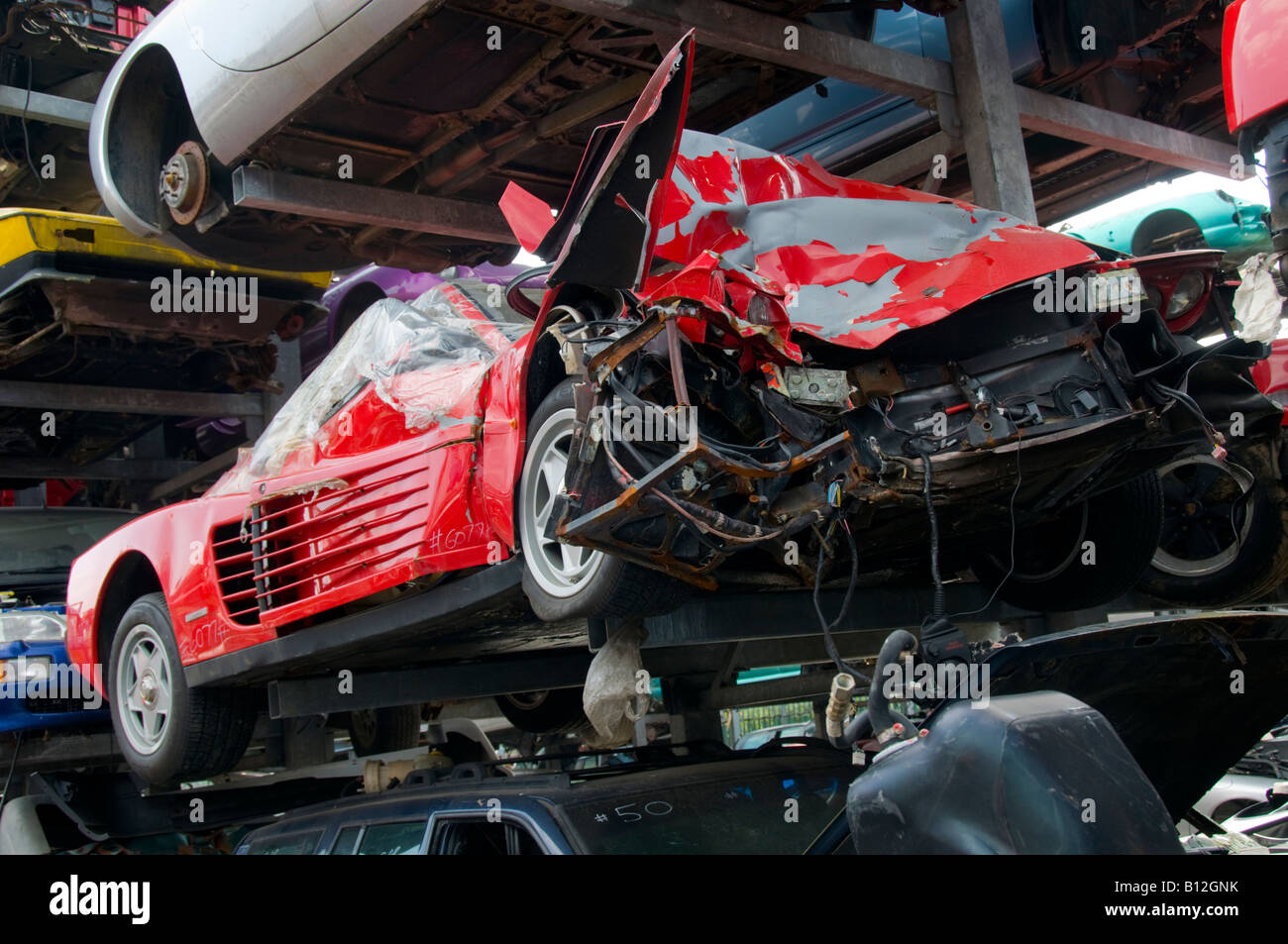High performance expensive crashed damaged Ferrari motor cars awaiting ...