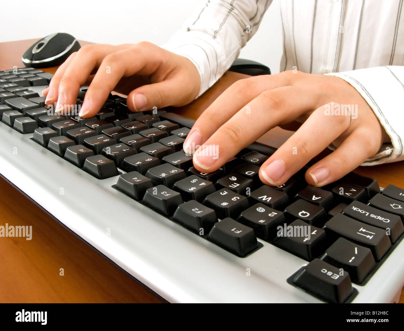 Businesswoman typing in the computer keyboard Stock Photo - Alamy
