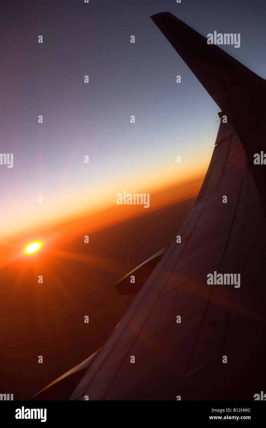 BOEING 737 700 WING SUNSET GLOW Stock Photo - Alamy