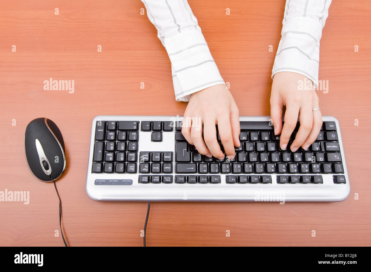 Businesswoman typing on a desktop computer keyboard /// business woman ...