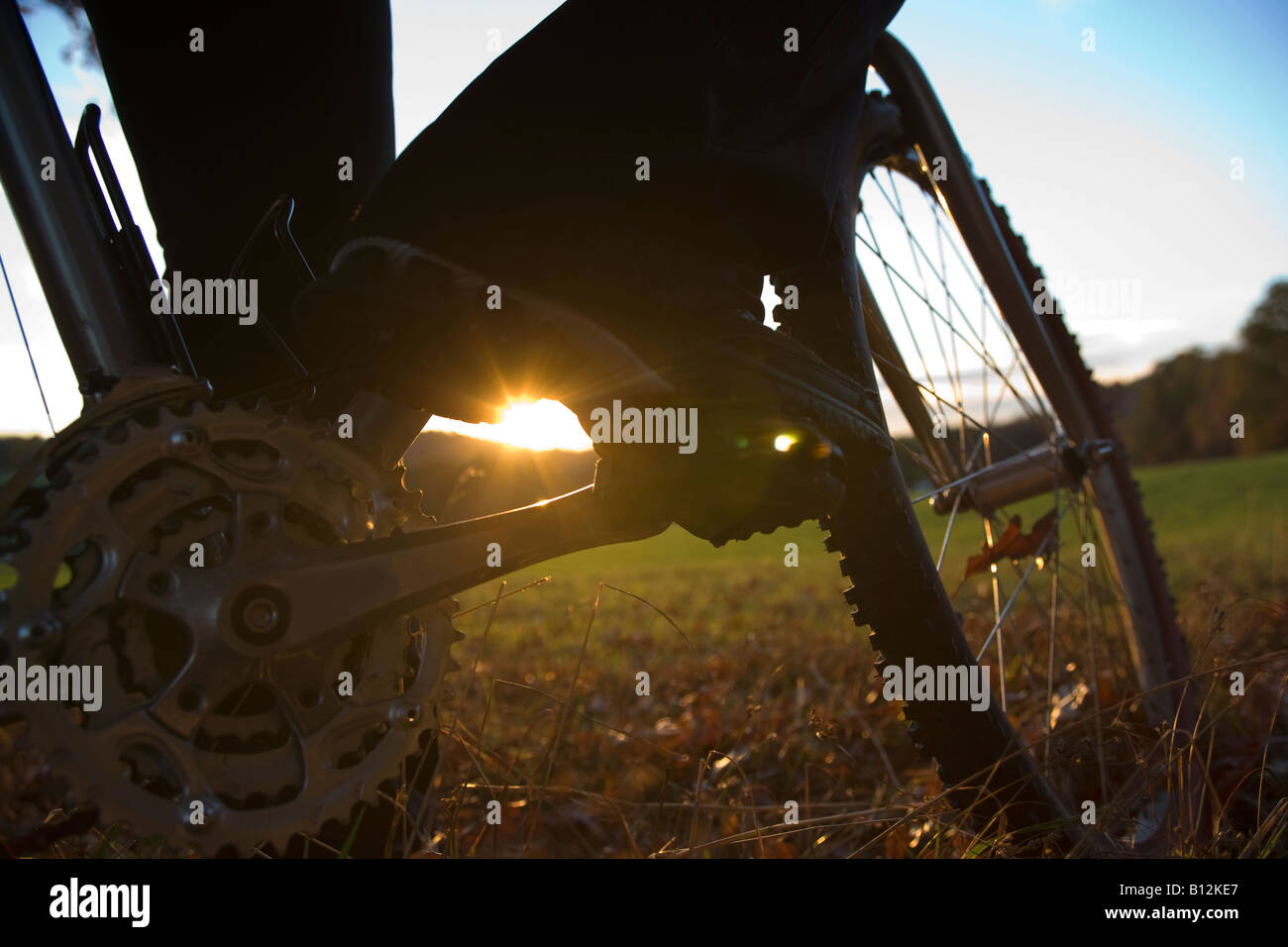 WOMAN RIDING BIKE ALONE OUTDOORS ON BICYCLE Stock Photo - Alamy
