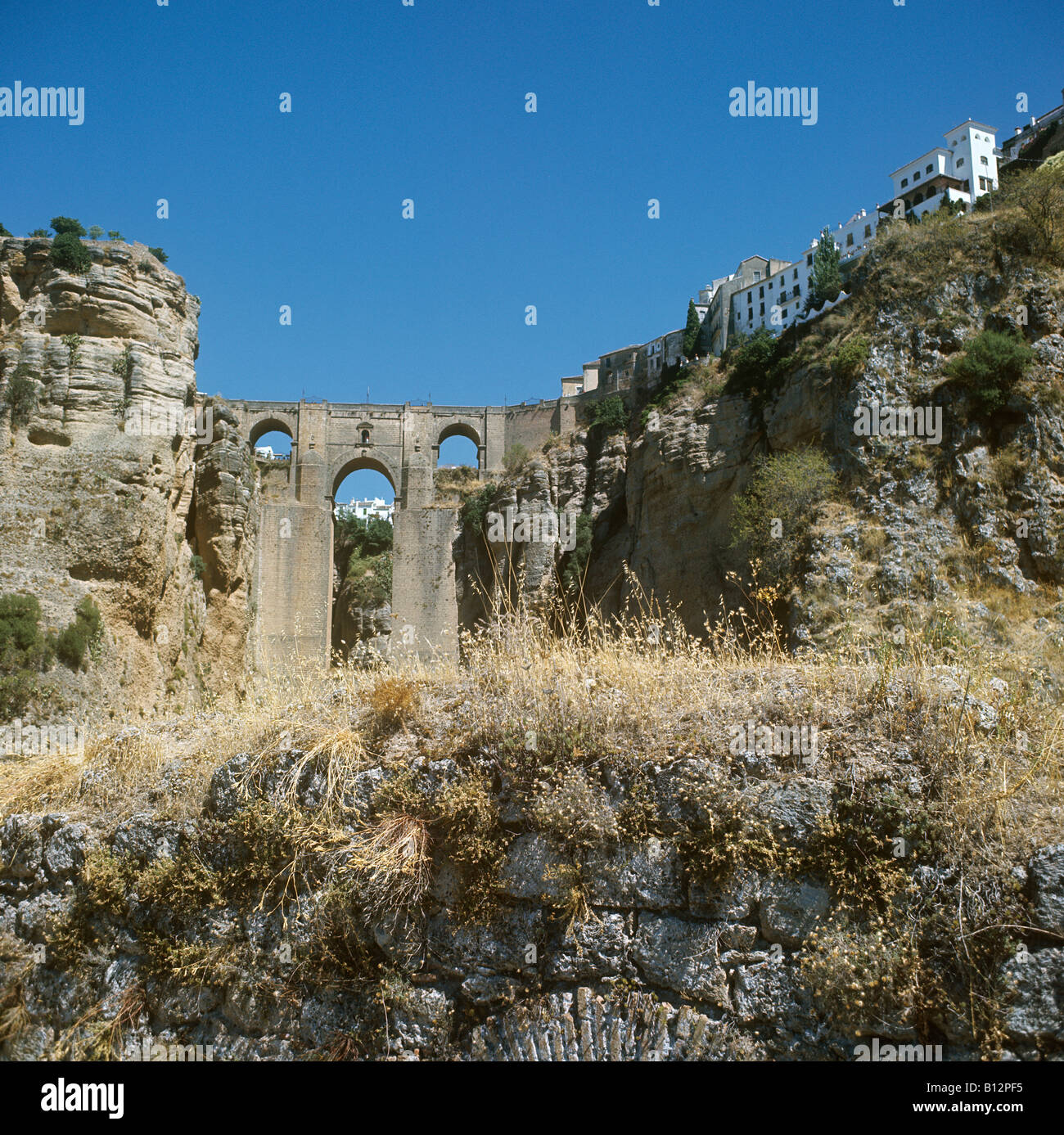 Ancient stone bridge crosses a deep gorge on the East side of Rhonda in ...