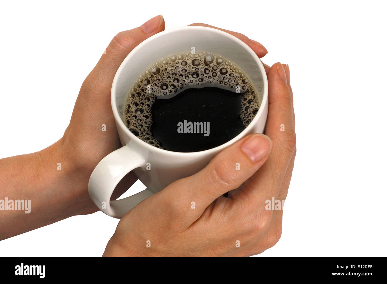 female hands holding a mug of hot coffee in order to keep warm Stock ...