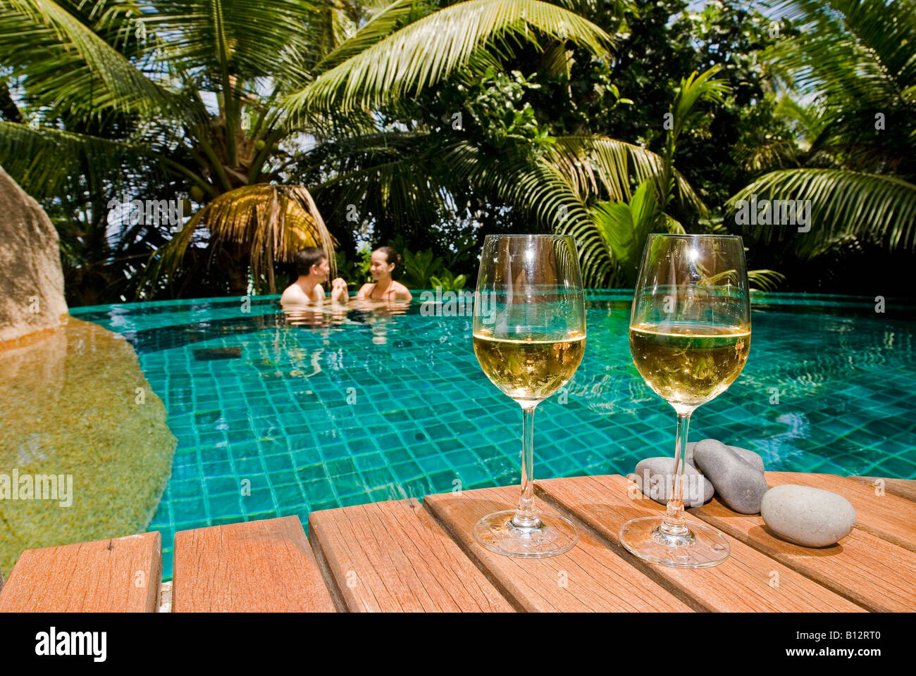 relaxing by the pool Stock Photo - Alamy