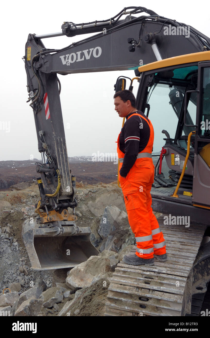 Mechanical digger and driver at Seqi olivine mine, Greenland Stock ...